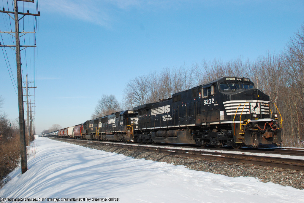 NS 9232 takes a tanker train east.
